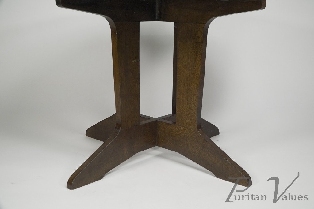 An Arts & Crafts good quality oak octagonal centre table with curved ...