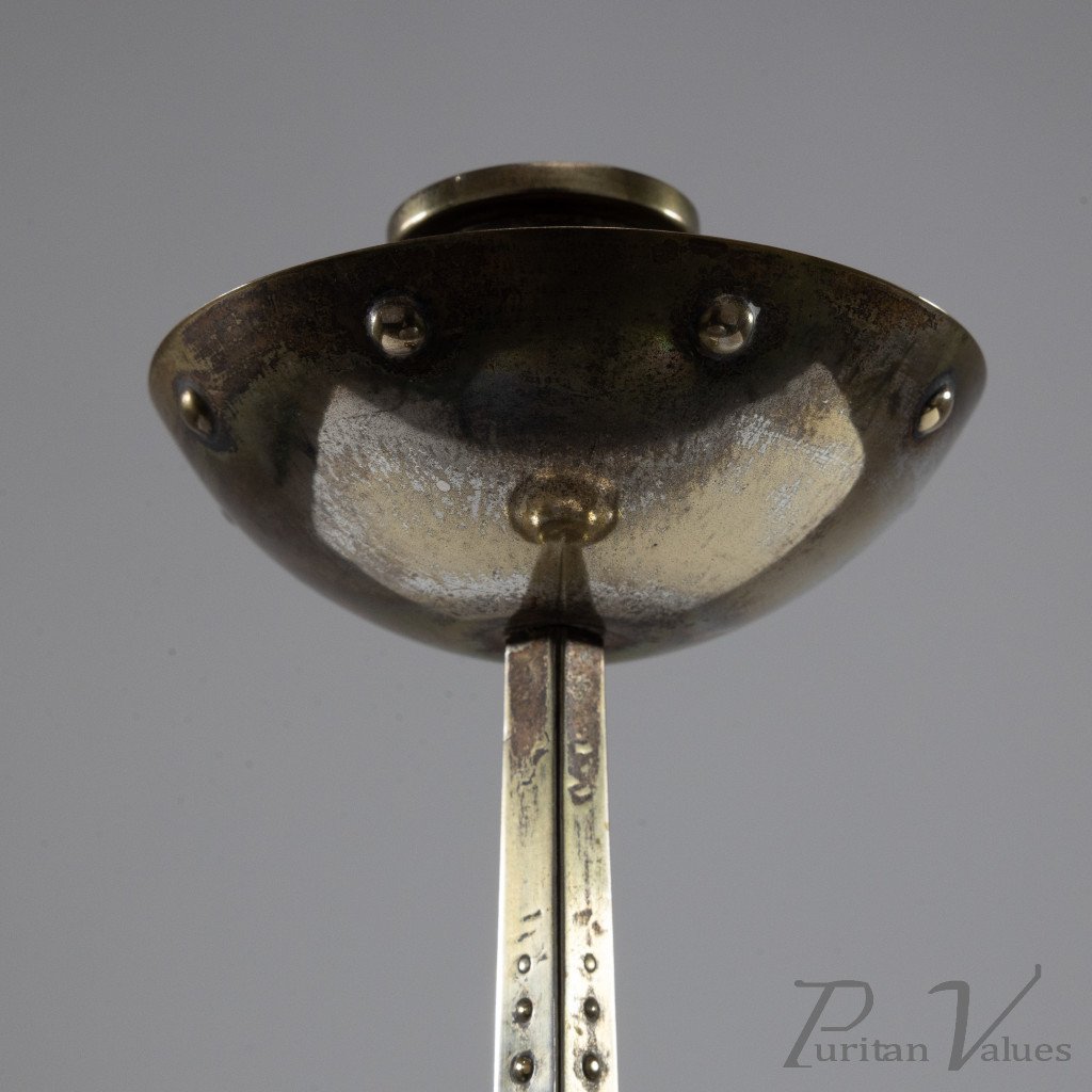 WMF An Arts & Crafts silver-plated candlestick with bowl shaped drip ...