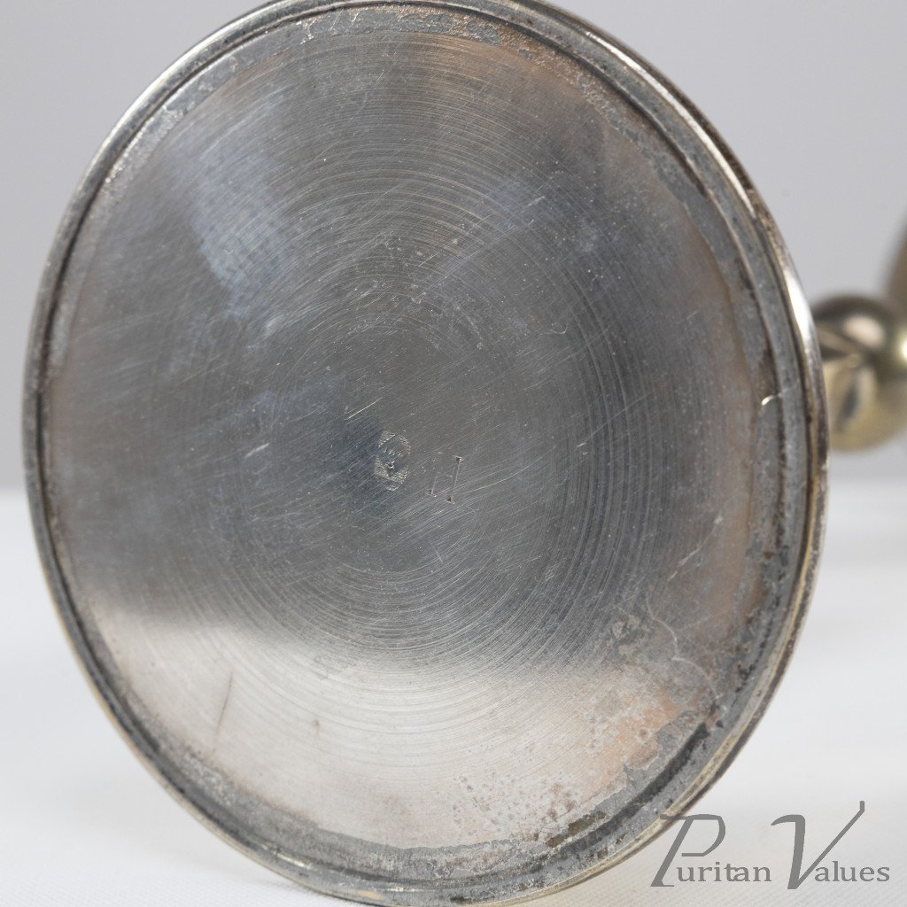 WMF An Arts & Crafts silver-plated candlestick with bowl shaped drip ...