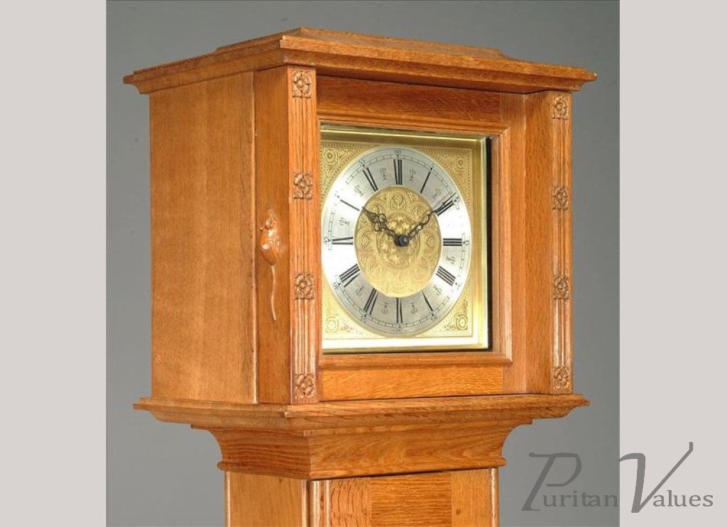 Robert Mouseman Thompson. A rare oak longcase clock - Puritan Values