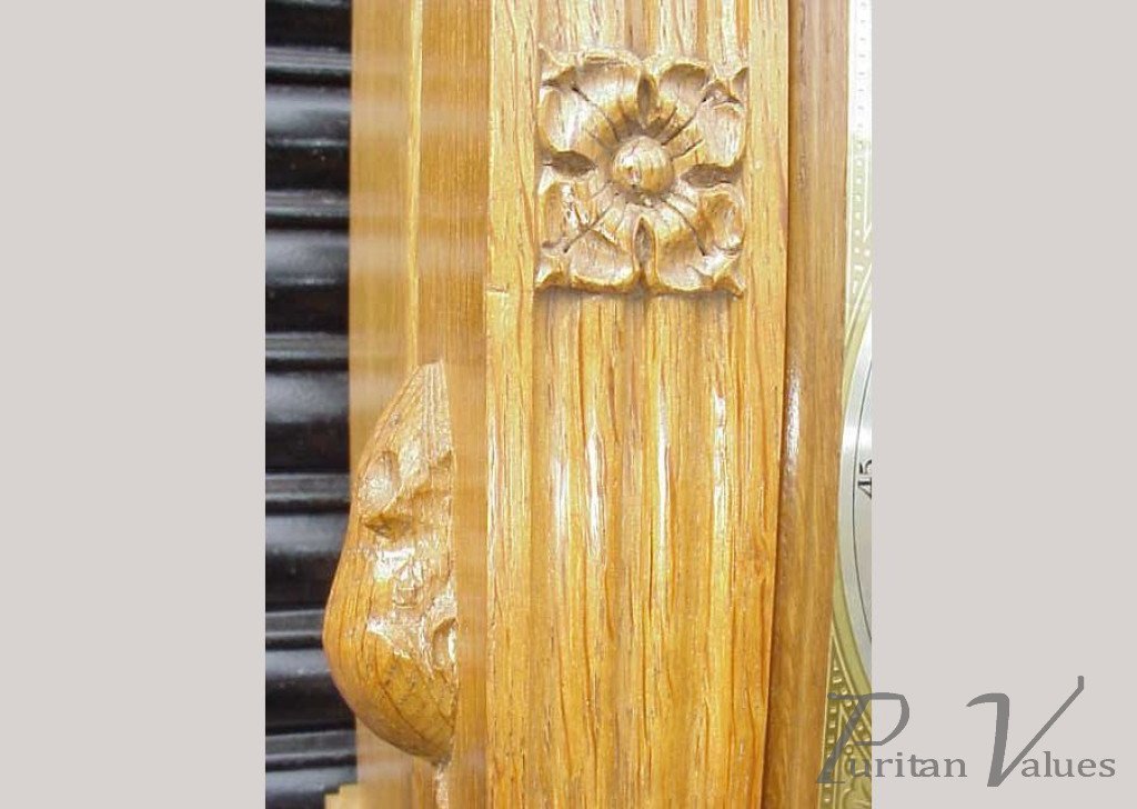 Robert Mouseman Thompson. A rare oak longcase clock - Puritan Values